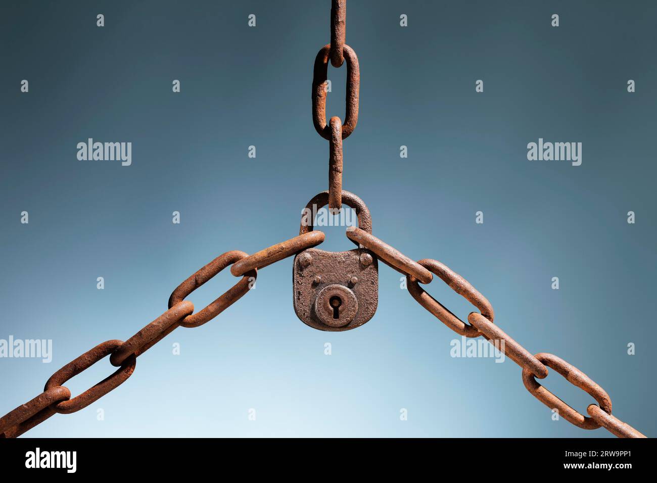 Old rusty lock holding three rusty chains together Stock Photo - Alamy