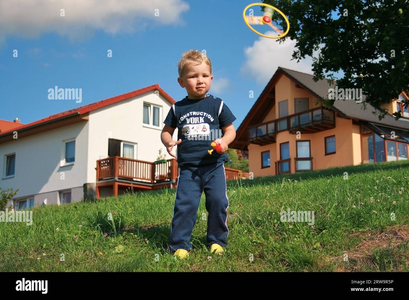 Little boy playing with propeller toy, summer Stock Photo - Alamy