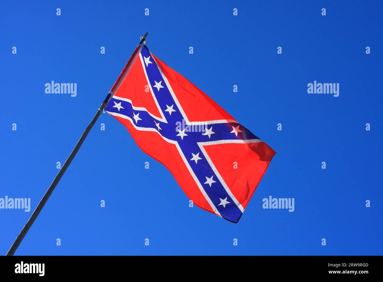 Waving Southern flag against a blue sky, taken slightly diagonally ...