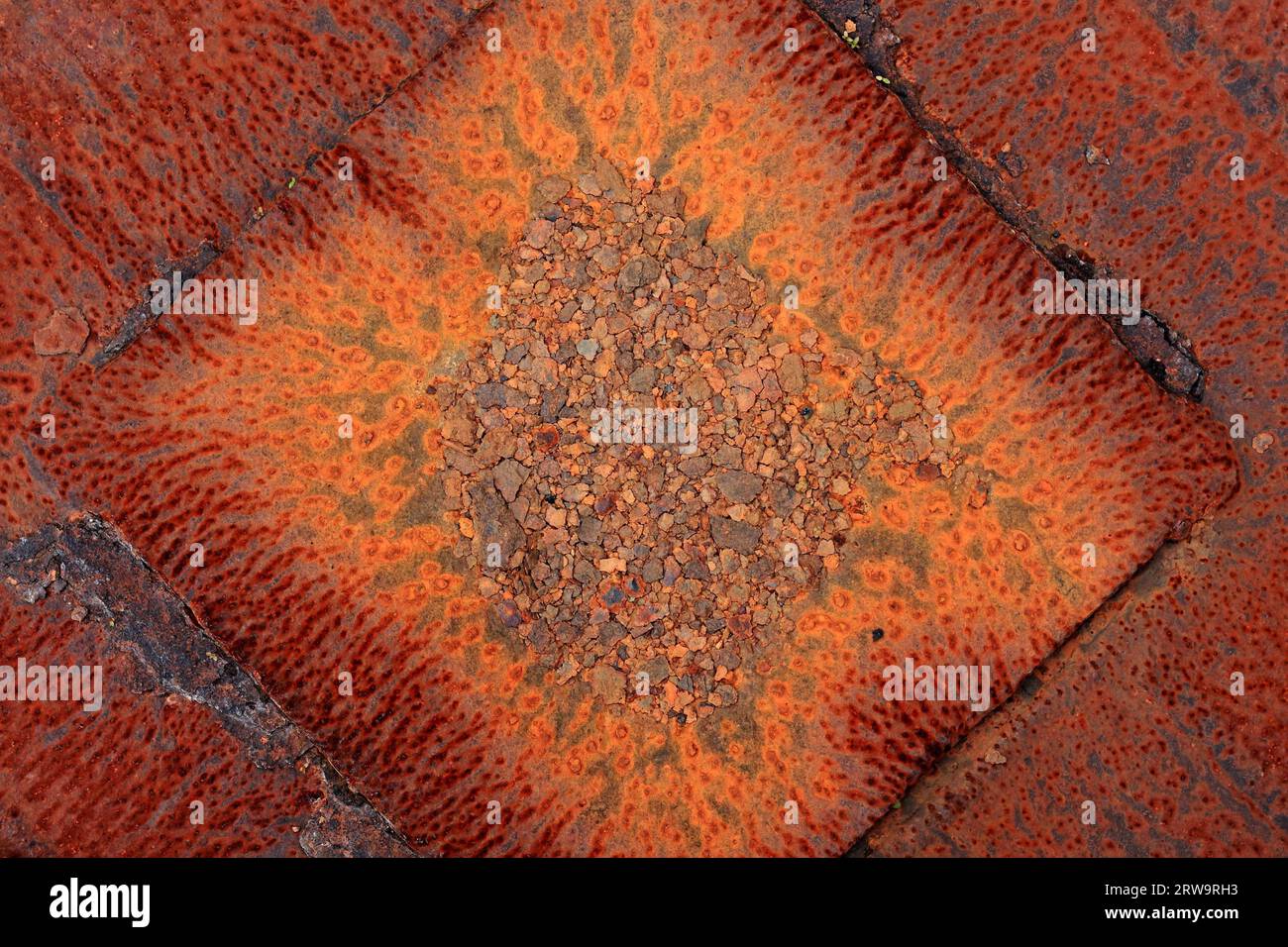 Different types and colours of rust on a rusted low piece, applied to ...