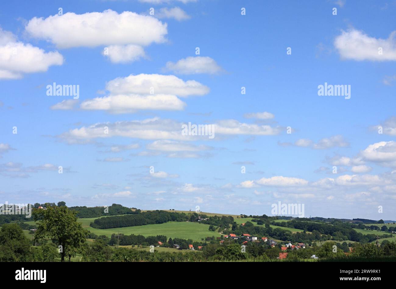 Landscape with sparse settlement in Saarland, background blue sky and ...