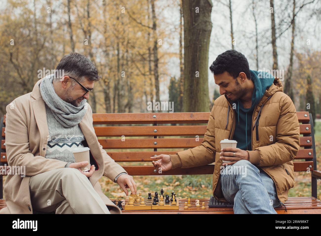 Different ethnic people playing chess hi-res stock photography and ...