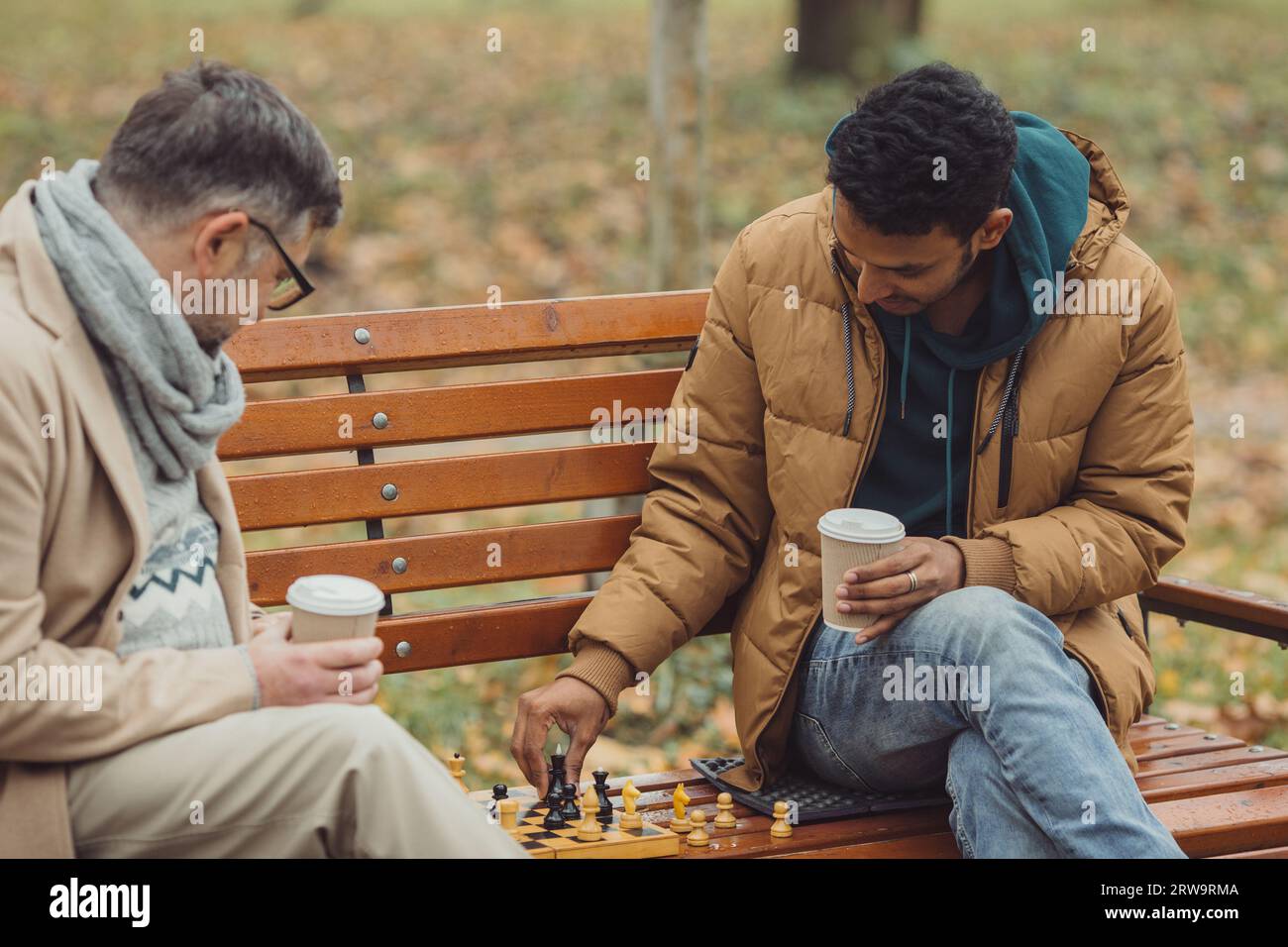 Different ethnic people playing chess hi-res stock photography and ...
