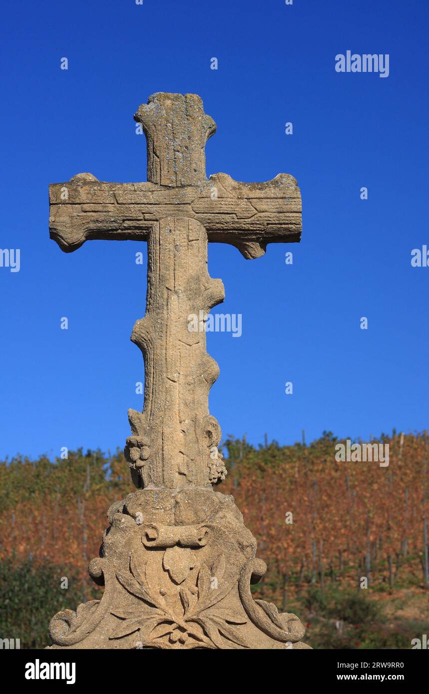 Stone cross at a crossroads, background vineyards and blue sky Stock ...