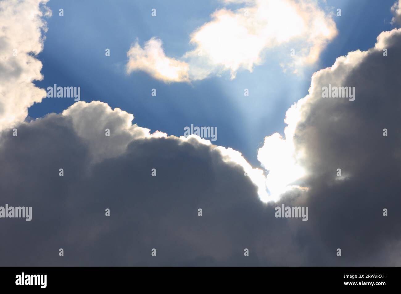 Rays of sunlight breaking through the clouds Stock Photo - Alamy