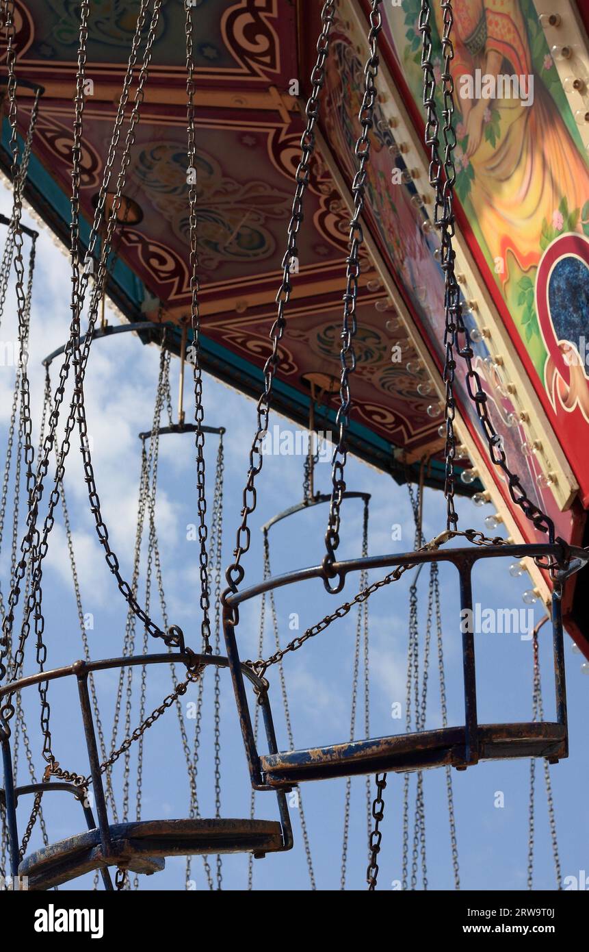 Chain carousel, detail, background blue sky Stock Photo - Alamy