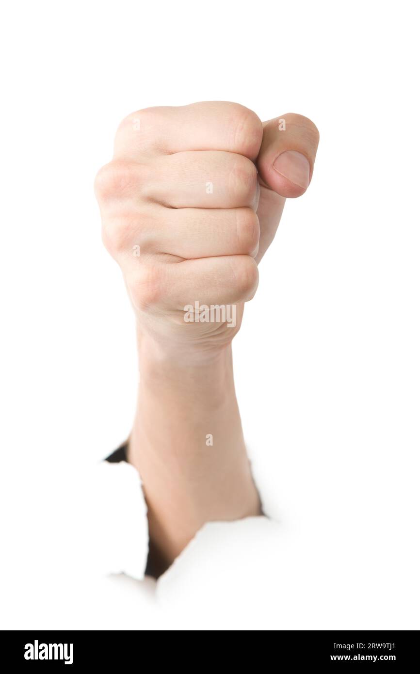 Human showing fist through the paper on white background Stock Photo ...
