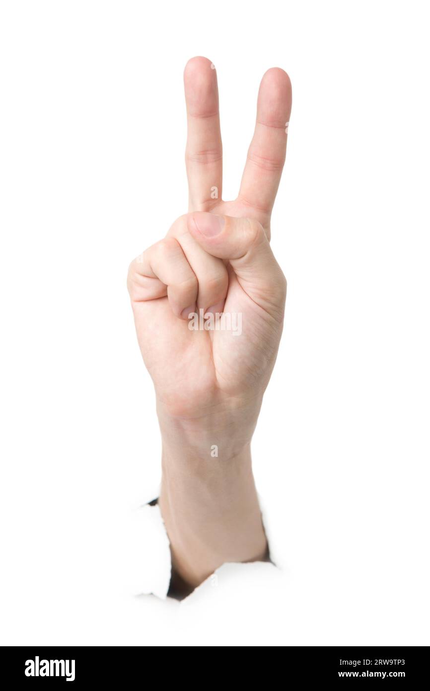 Victory sign tearing paper on white background Stock Photo - Alamy
