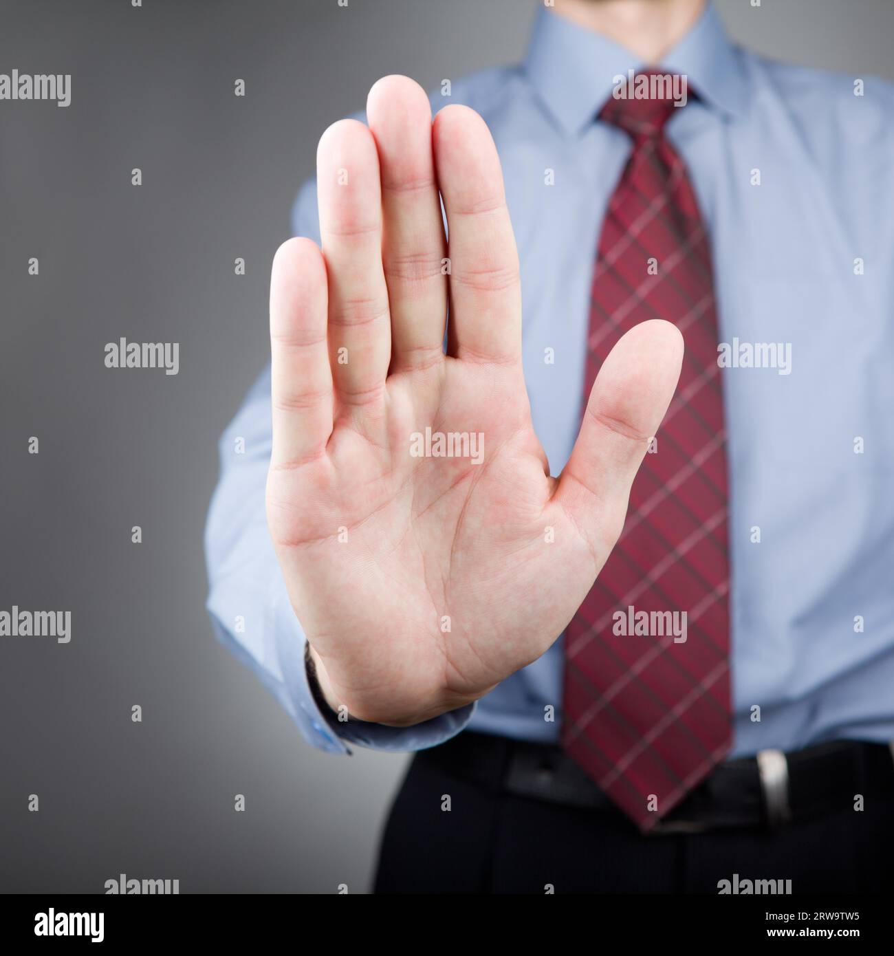 Stop hand sign showing by young man Stock Photo - Alamy