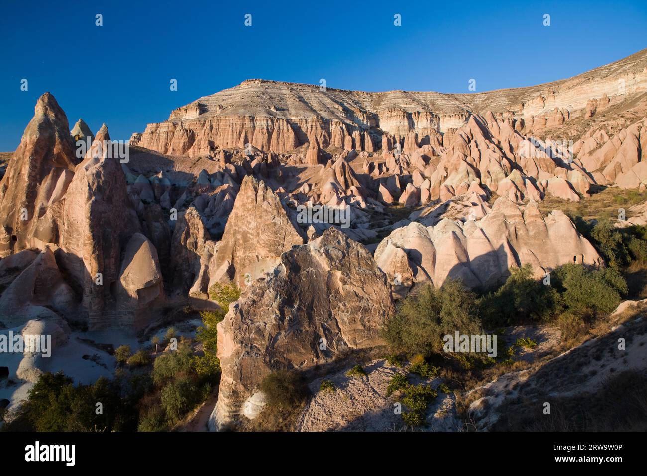 Cappadocia fairy chimneys at sunset Stock Photo - Alamy