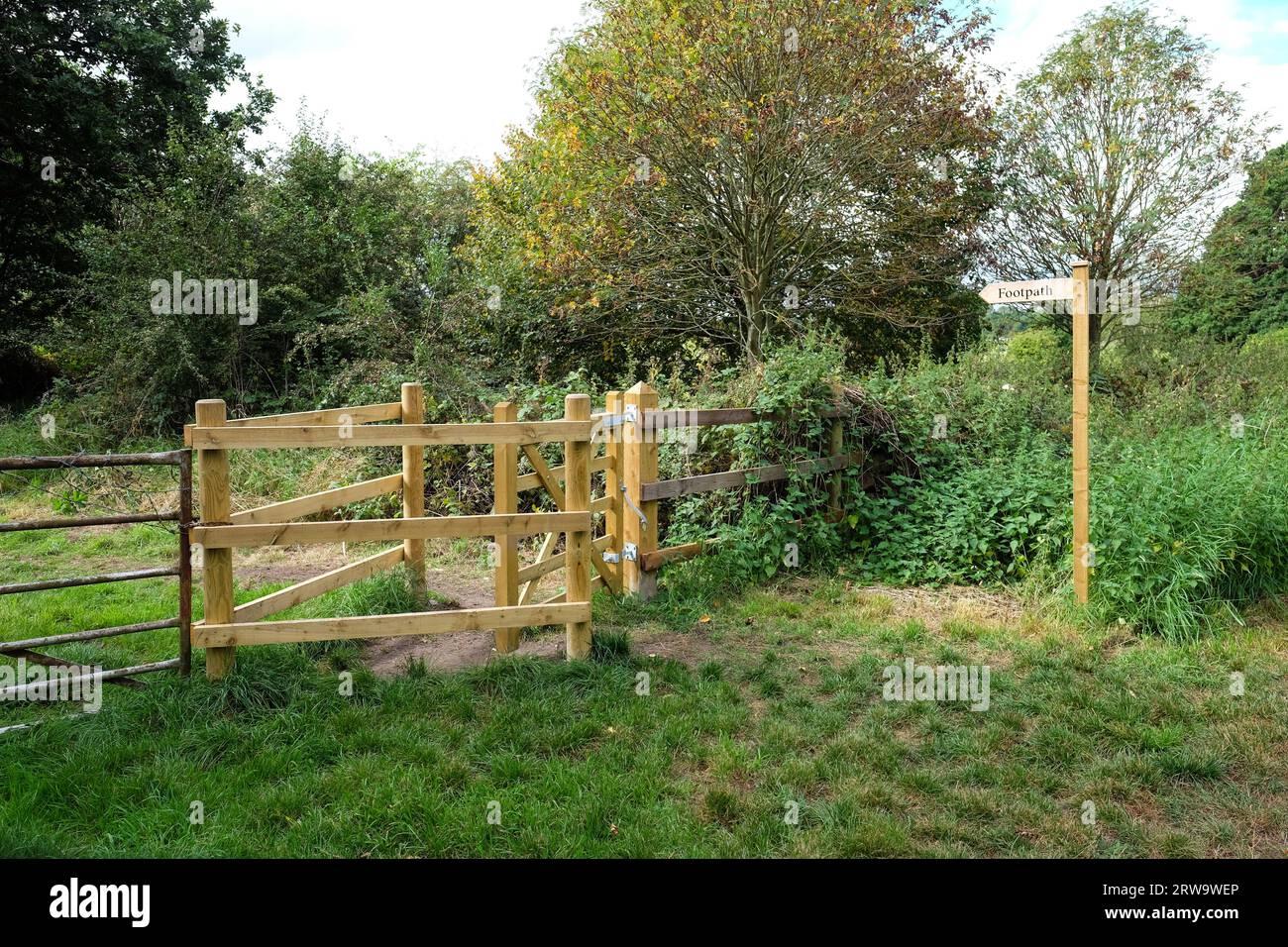 new wooden kissing gate Stock Photo - Alamy