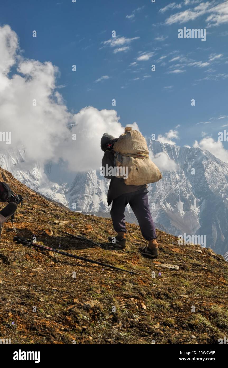 Sherpa in picturesque Himalayas mountains in Nepal Stock Photo - Alamy