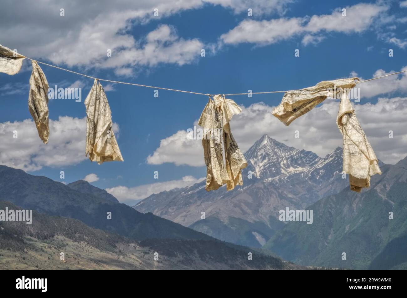Buddhist prayer flags in Nepal with picturesque himalayan peak in the ...