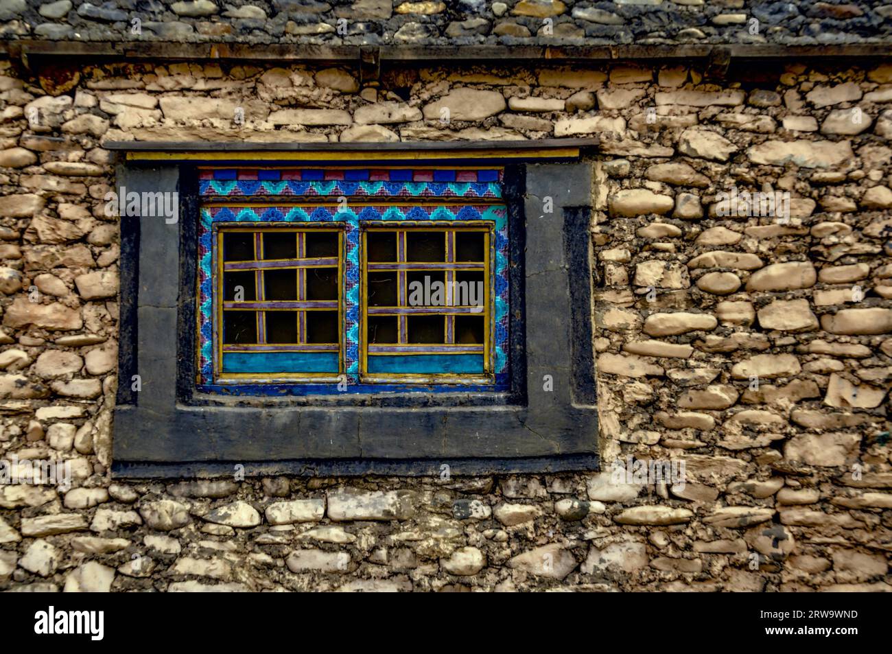 Traditional decorated window on old stone nepalese house Stock Photo ...