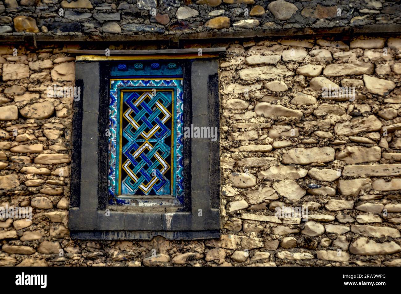 Traditional decorated window on old stone nepalese house Stock Photo ...
