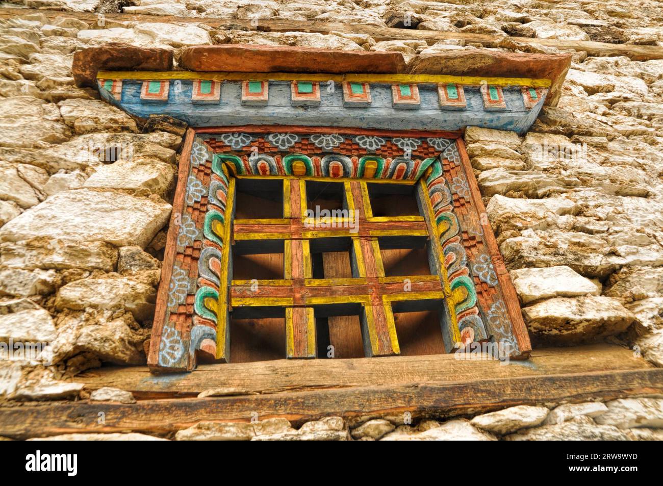 Traditional decorated window on old stone nepalese house Stock Photo ...