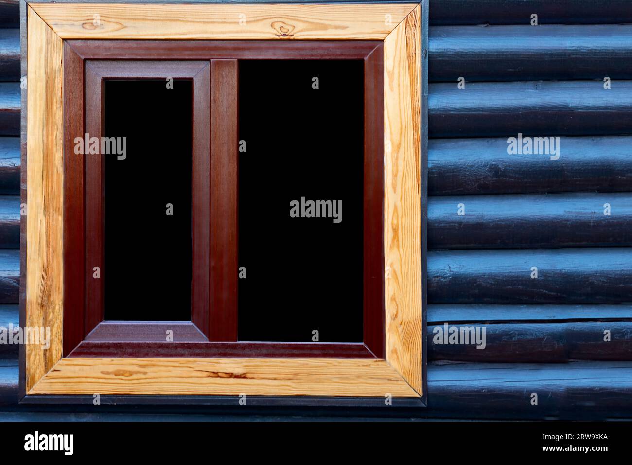 Brown window in a wooden frame in a wooden wall of logs timbers Stock ...