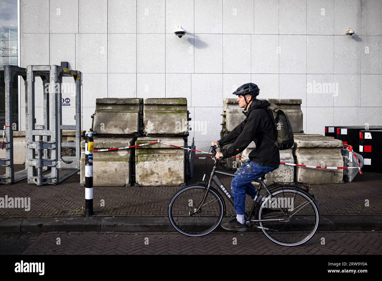 THE HAGUE - Employees place blockades on the roads along the route on ...