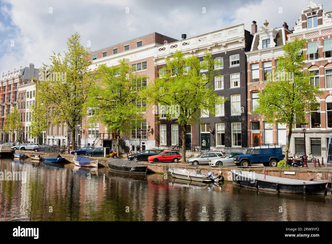 Historic buildings along canal in the city of Amsterdam, Netherlands ...