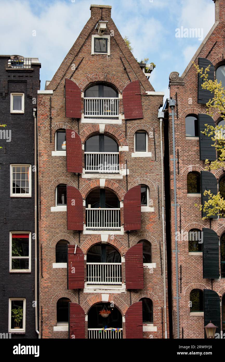 Historic house with window shutters and simple triangular gable in ...