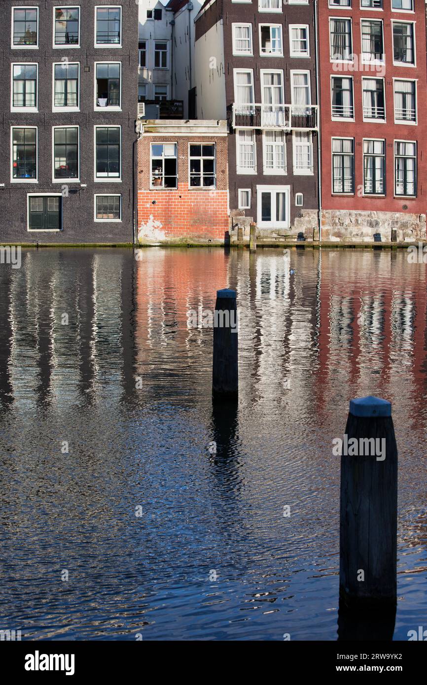 Traditional Dutch style row houses on the water in Amsterdam, Holland ...