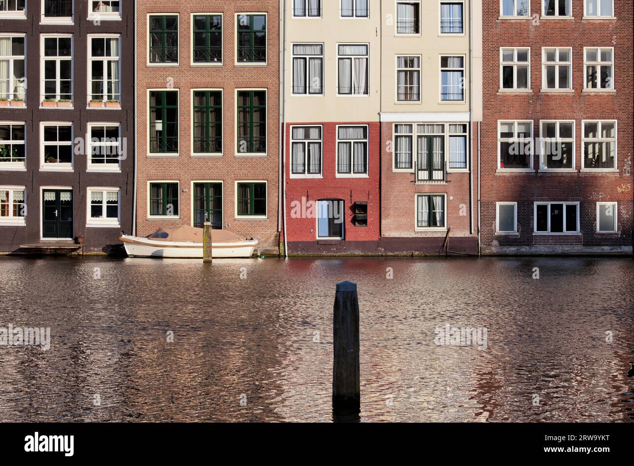 Traditional Dutch style historical row houses on a cana in Amsterdam ...