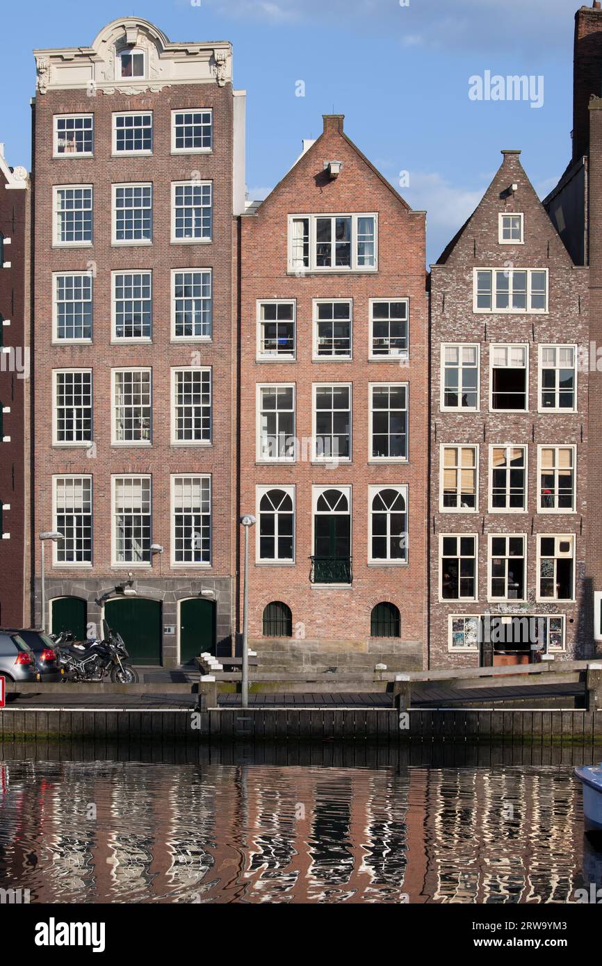 Dutch style row houses by the water in Amsterdam, Holland, Netherlands ...