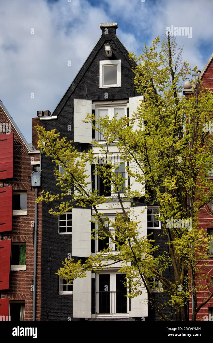 Historic house with white window shutters and triangular gable ...