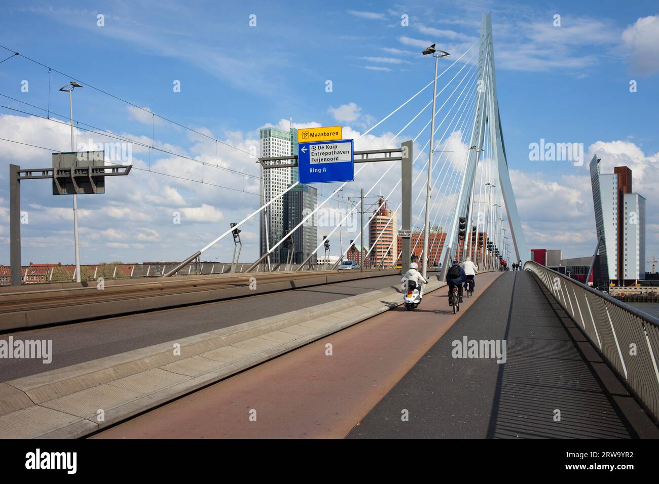 Street, sidewalk and bicycle path on Erasmus Bridge in the city of ...