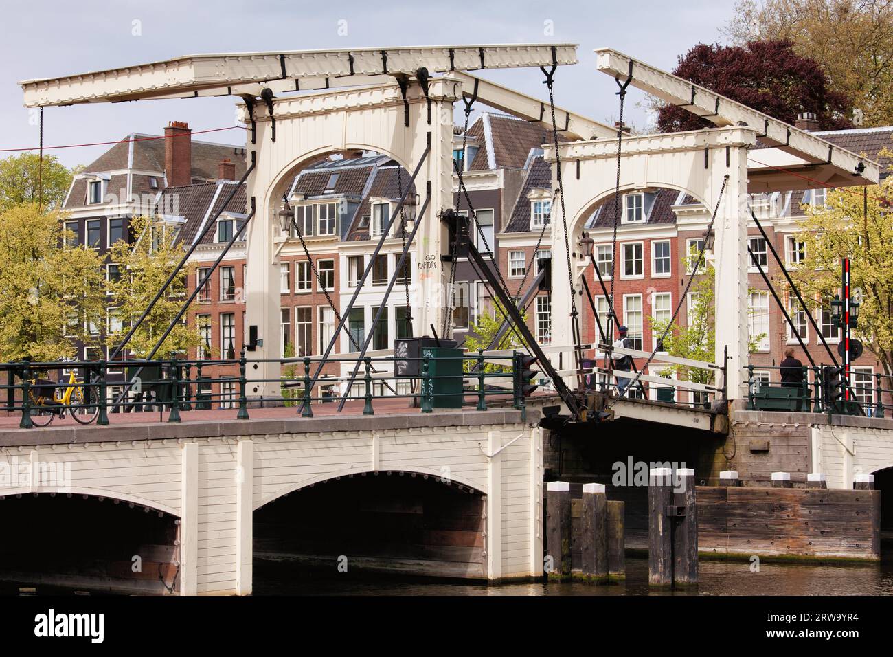Skinny Bridge (Dutch: Magere Brug) over the Amstel river in Amsterdam ...