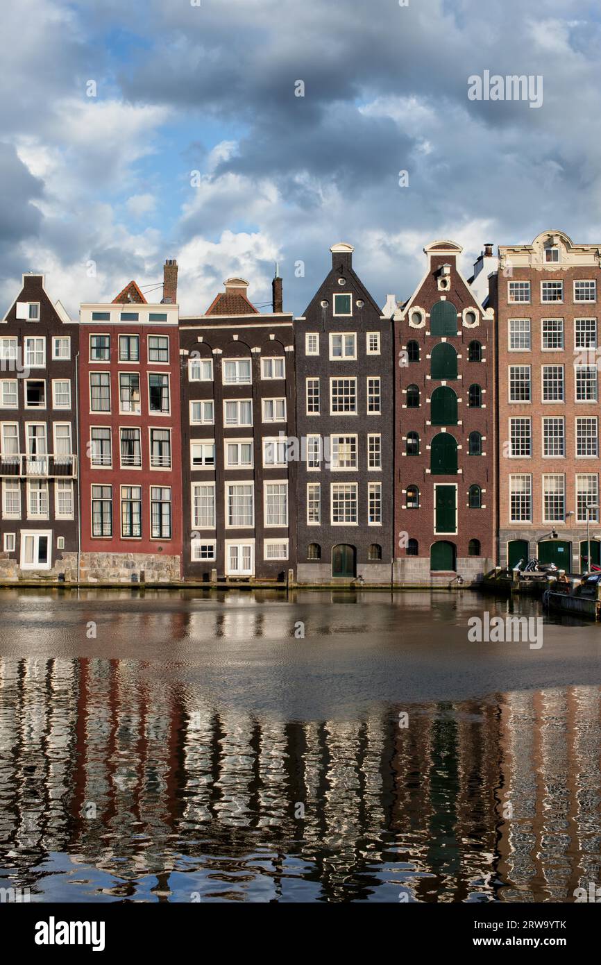 Terraced Dutch style historic houses with reflections on a canal water ...
