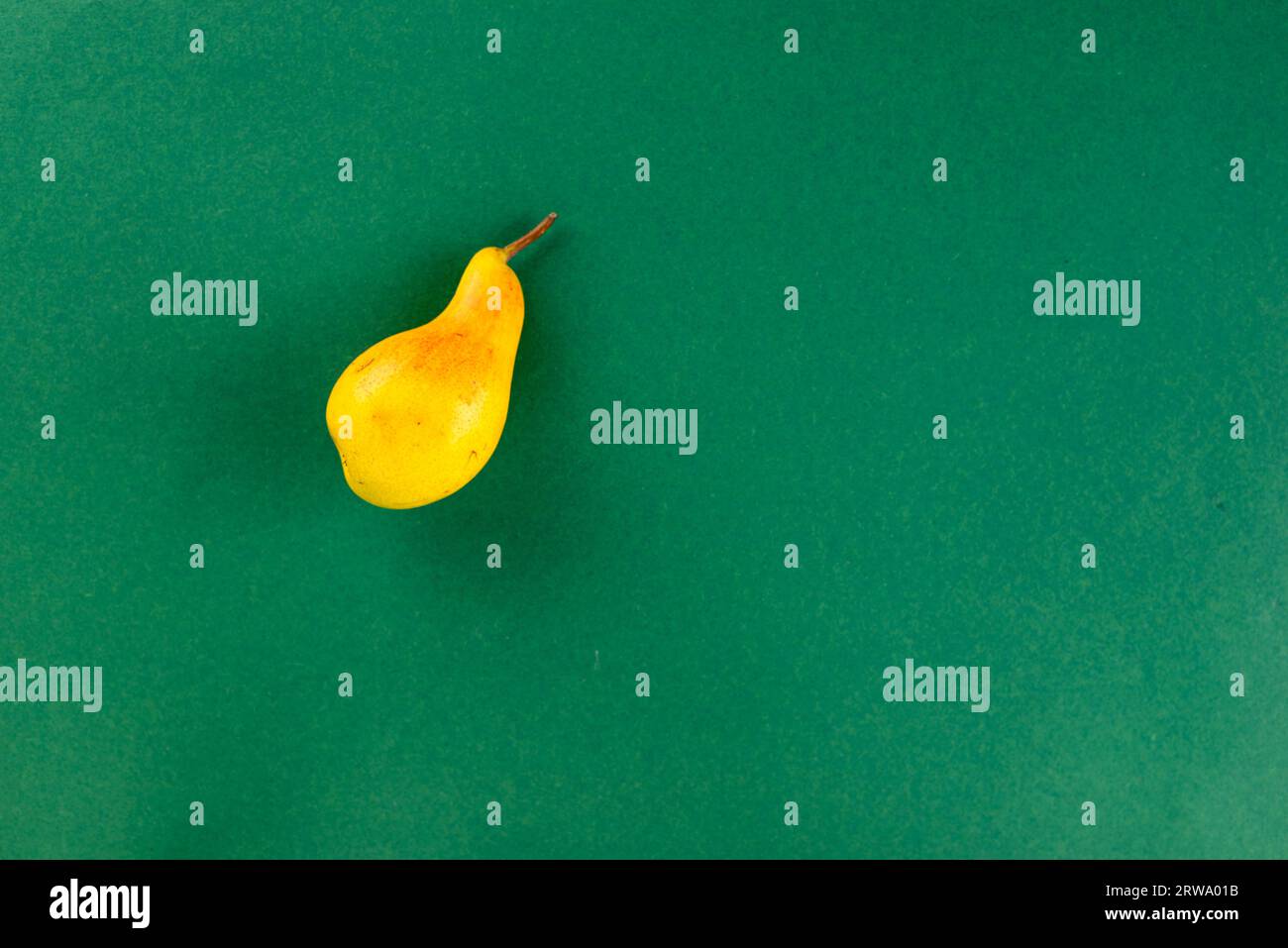 fresh pear closeup. Green background with yellow-green pears Stock ...