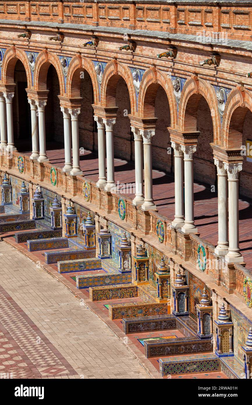Colonnade and tiled benches of the Plaza de Espana pavilion in Seville ...