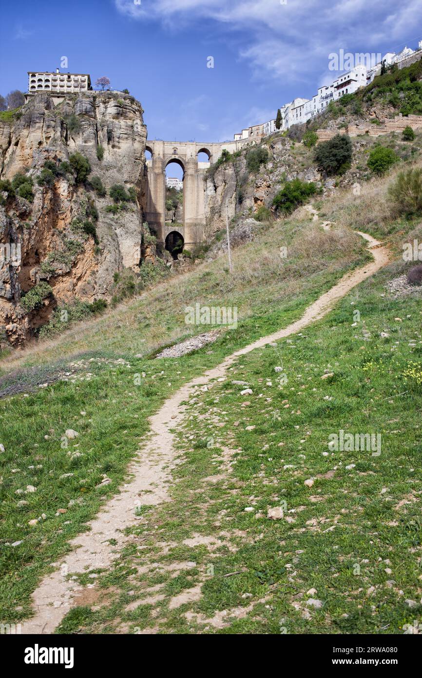 Path on a hill slope meadow in Andalusia countryside towards Puento ...
