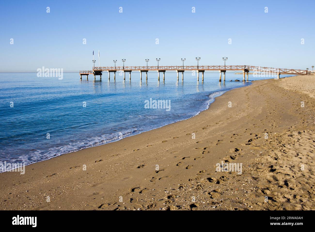 Spain, Marbella, Costa del Sol, sandy, empty beach at Mediterranean Sea ...