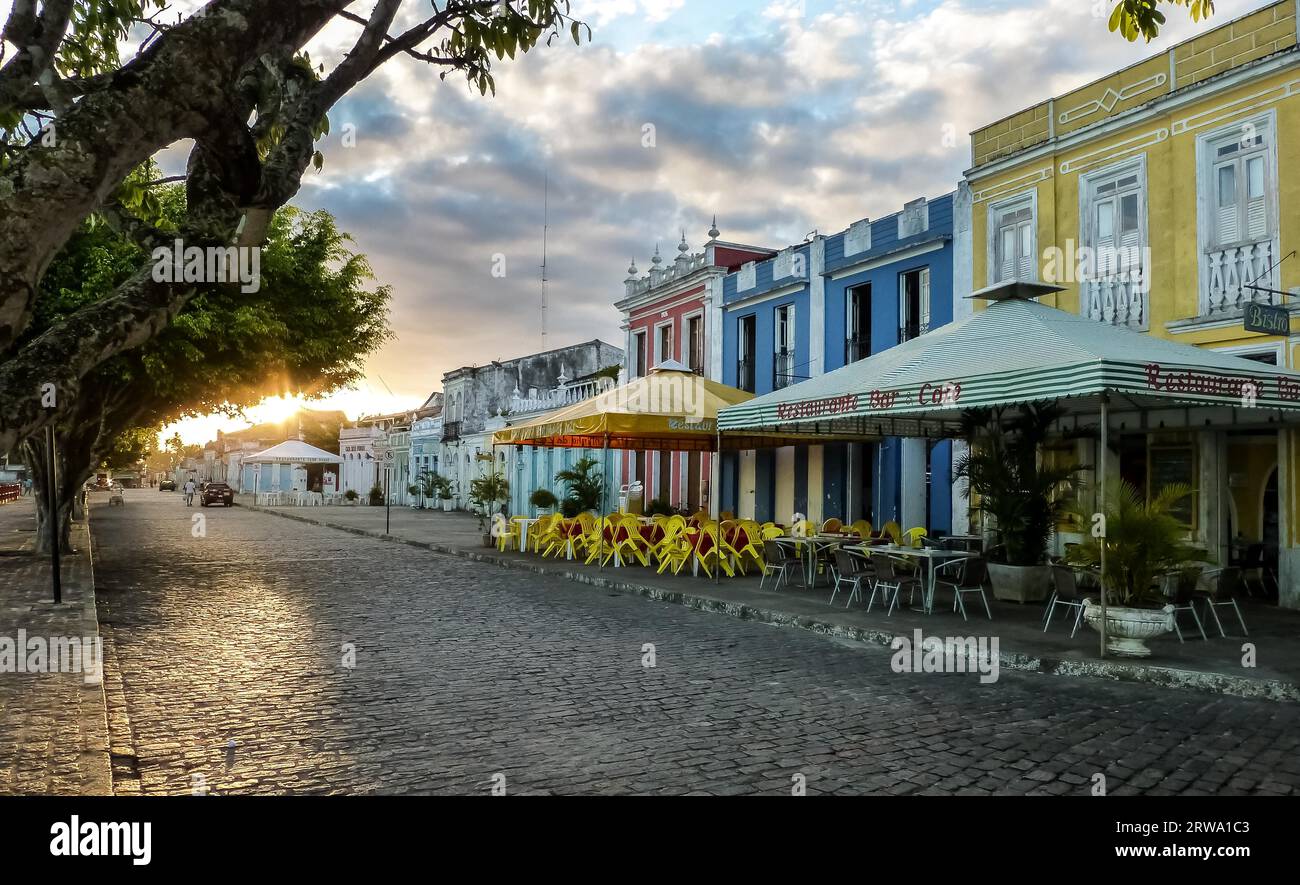 Sunset at the old harbor promenade with colorful old buildings in the ...
