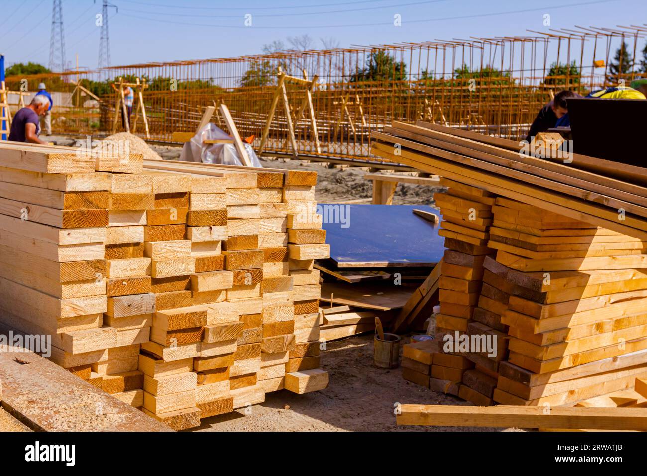 Yellow wooden chopped planks arranged in a row placed at the alfresco ...