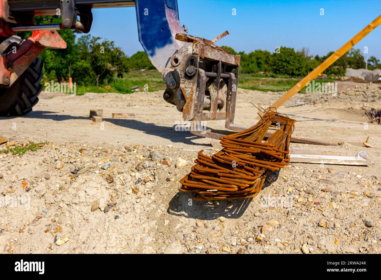 Forklift machinery for delivery and transport is preparing to lift up ...