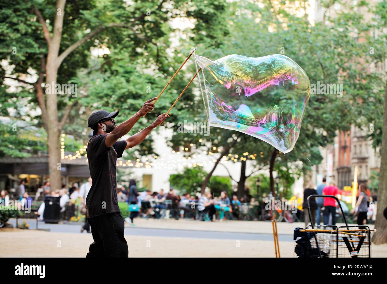 NEW YORK CITY, USA, JUNE 13: Man making big soap bubbles at Madison ...