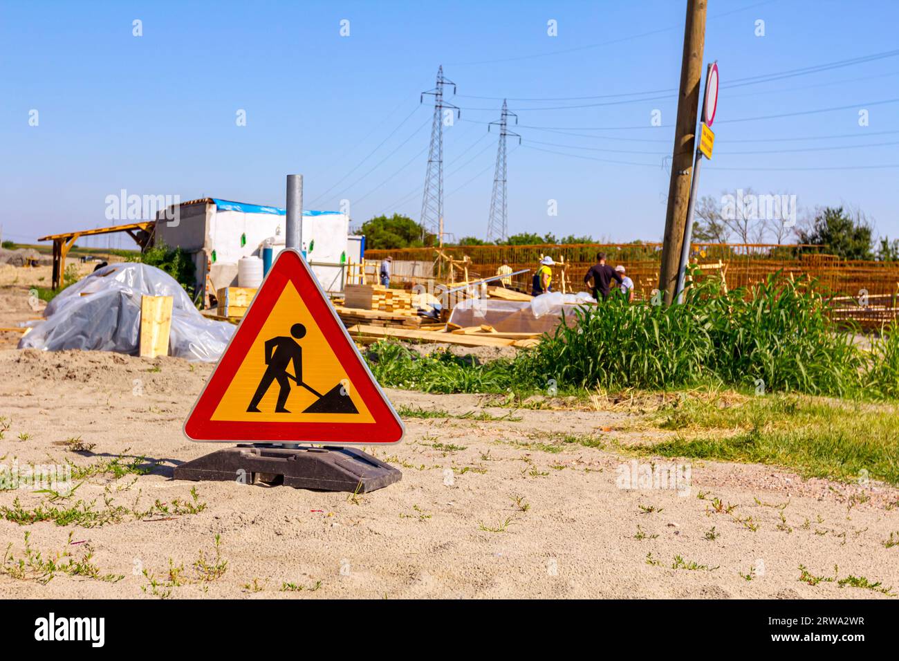 Triangular traffic sign with caution symbol of warning, work in ...