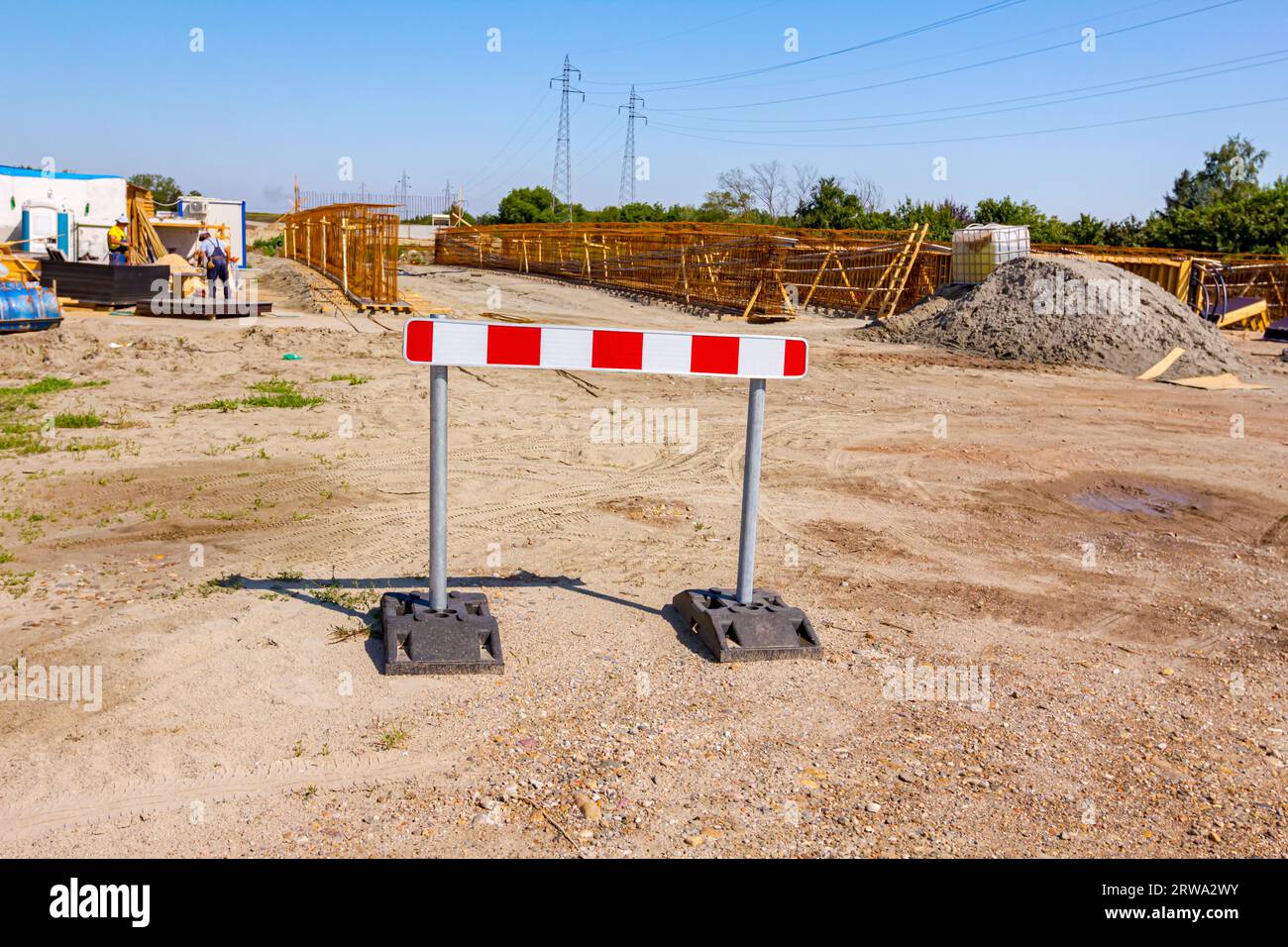 Work in progress, boundary sign, red and white stripes on it, barrier ...