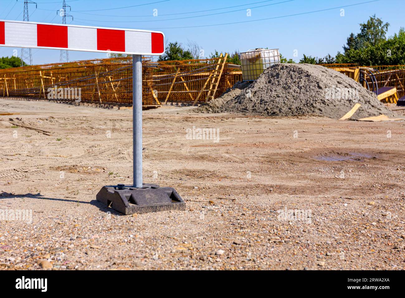 Work in progress, boundary sign, red and white stripes on it, barrier ...