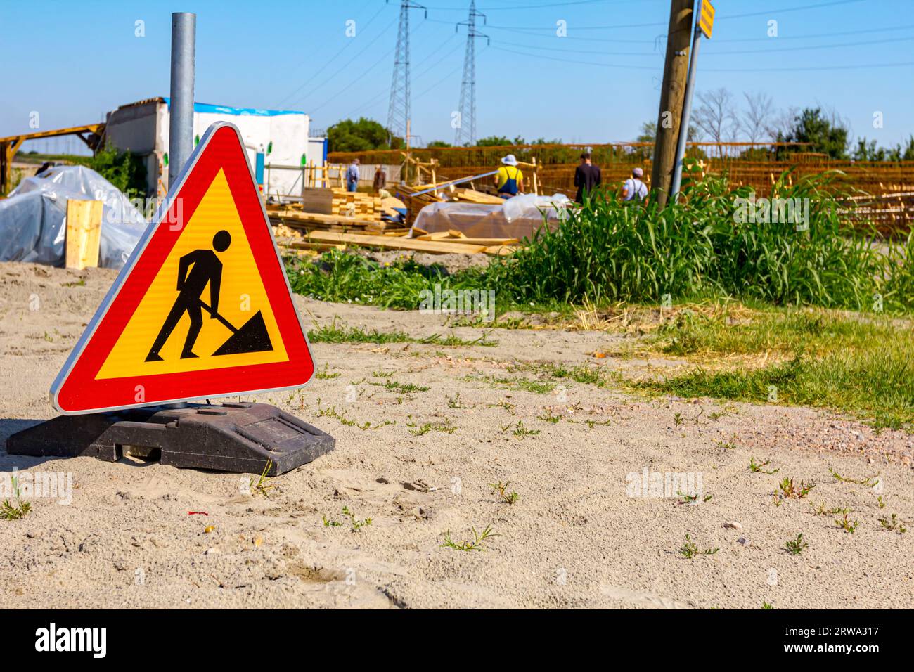 Triangular traffic sign with caution symbol of warning, work in ...
