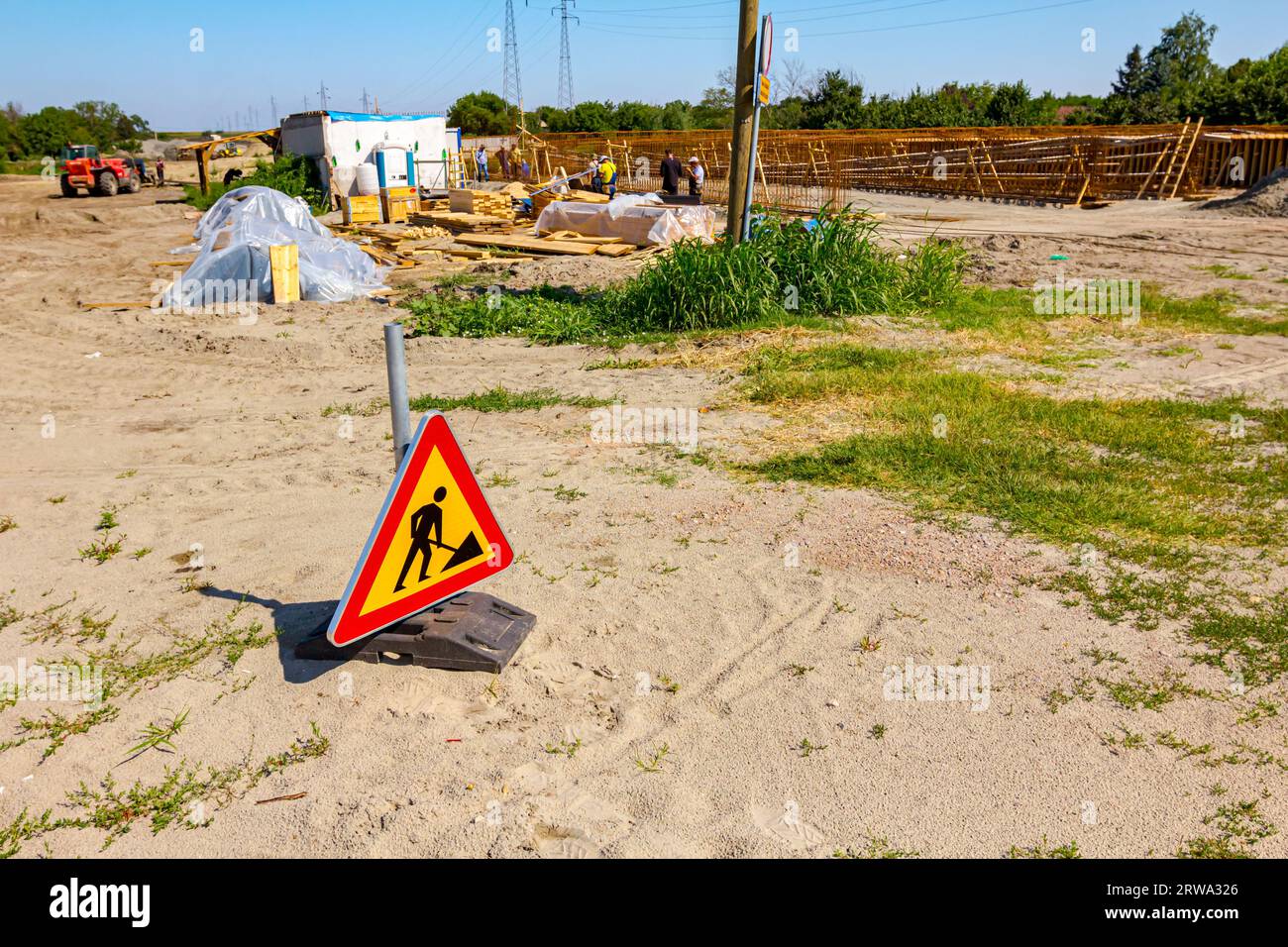 Triangular traffic sign with caution symbol of warning, work in ...