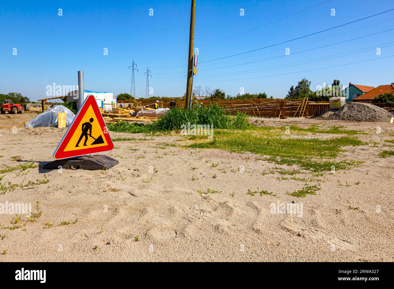 Triangular traffic sign with caution symbol of warning, work in ...