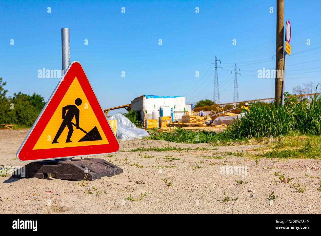 Triangular traffic sign with caution symbol of warning, work in ...