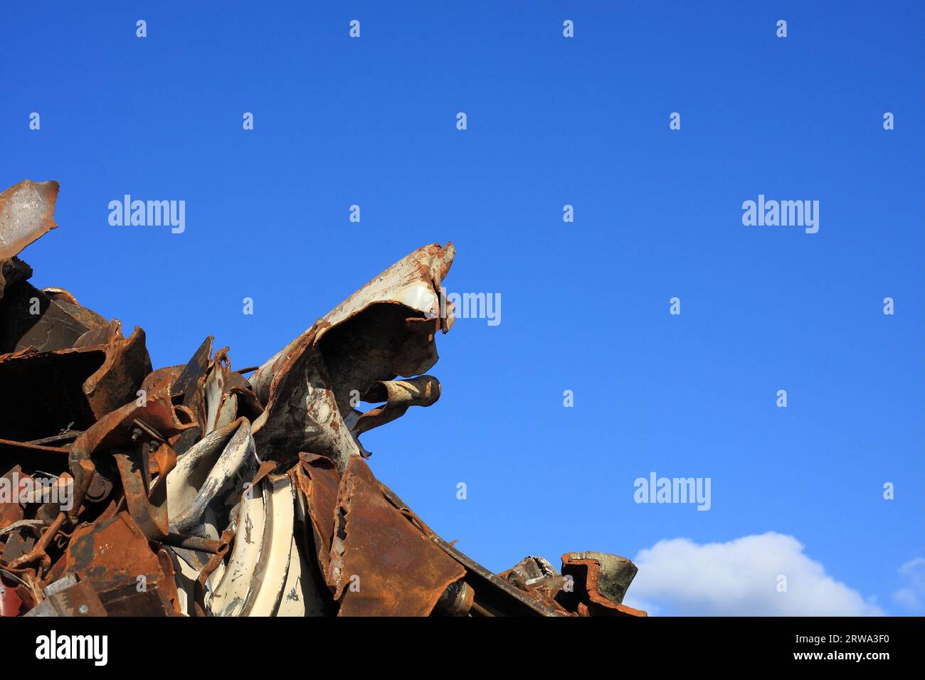 Scrap iron in a scrap yard, background blue sky with white cloud Stock ...