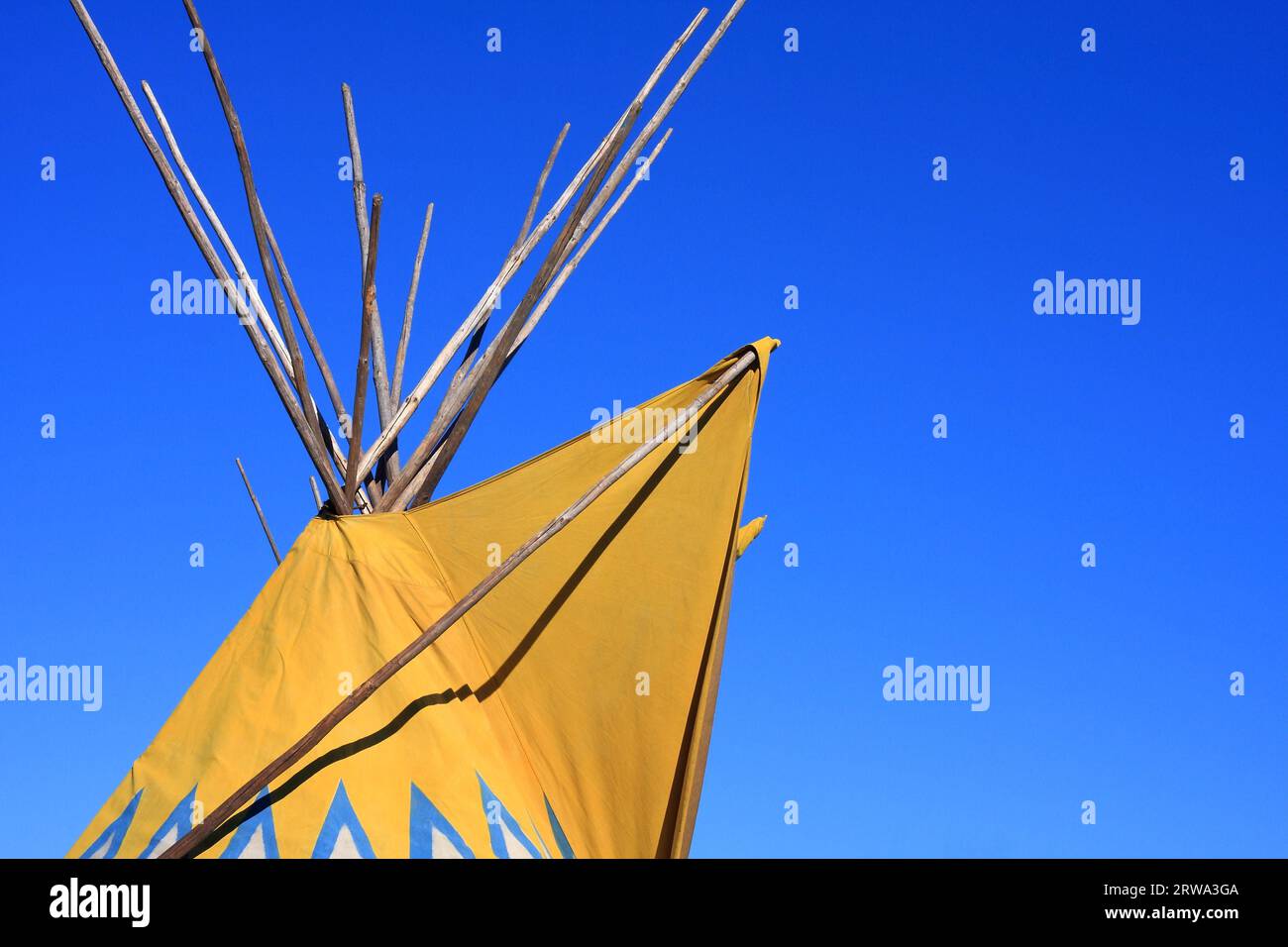 Ochre Indian tent, with blue and white pattern, background blue sky ...