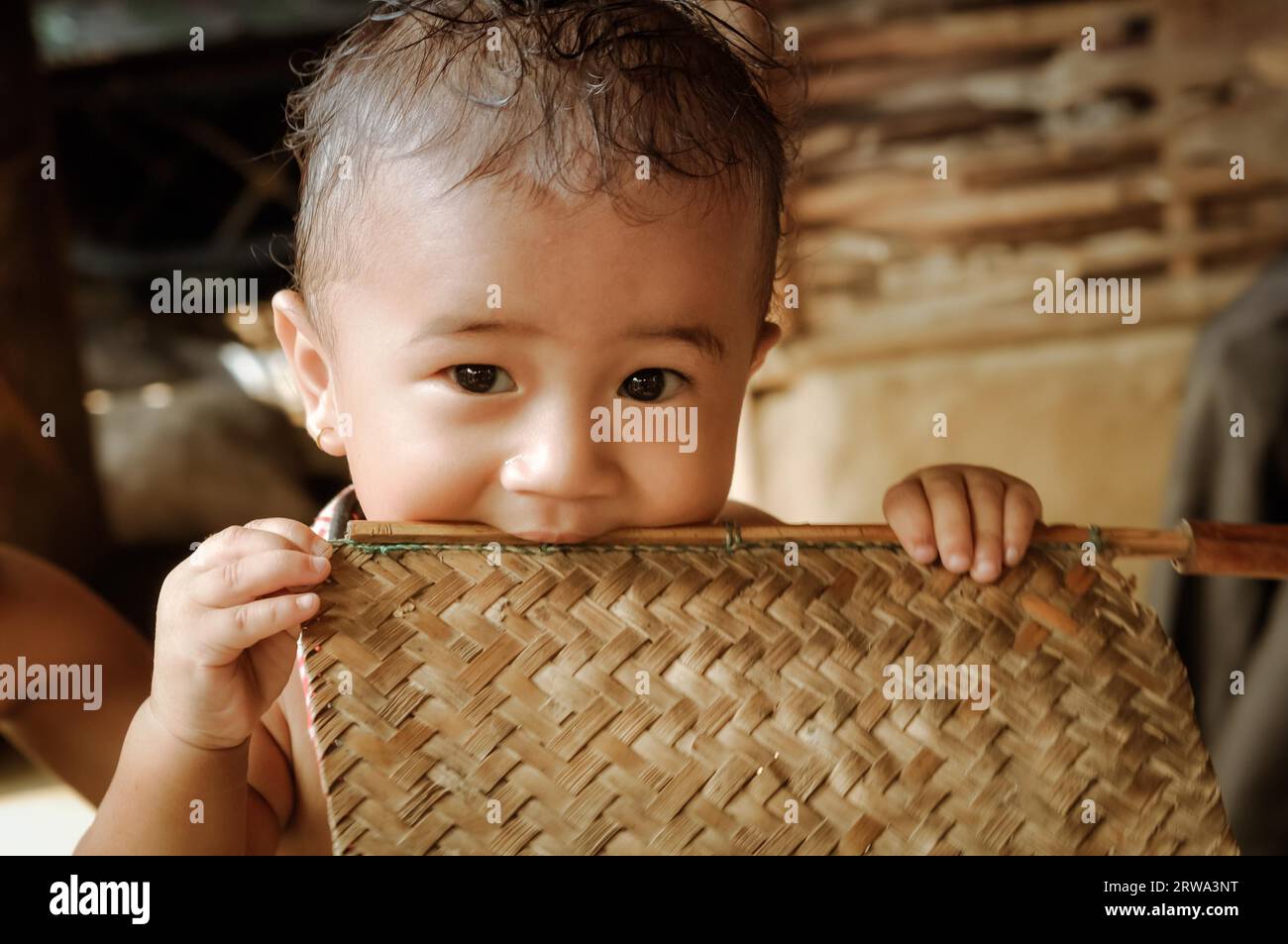 Damak, Nepal, circa May 2012: Photo of small cute boy looking to ...
