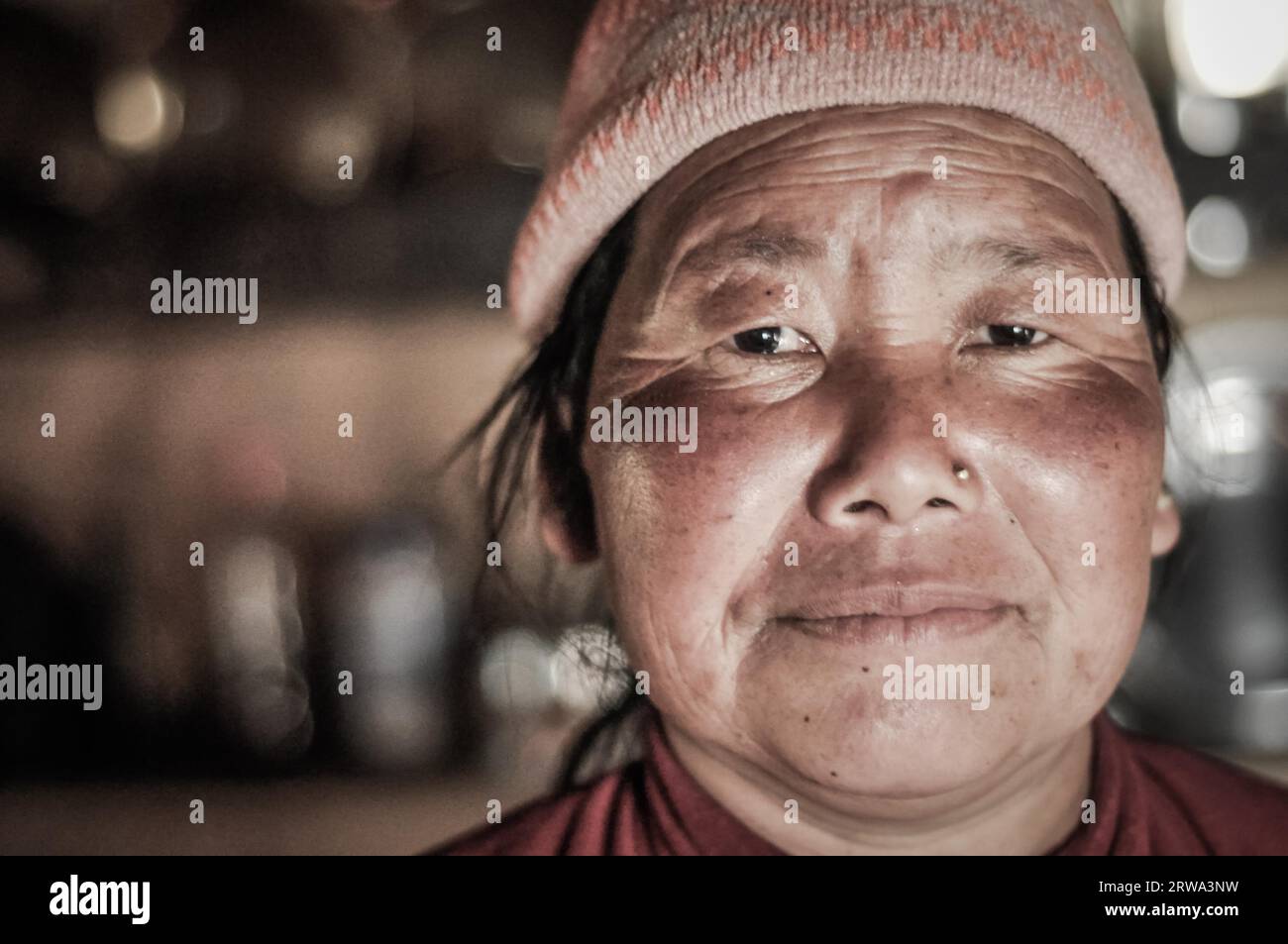 Kanchenjunga Trek, Nepal, circa May 2012: Woman with cap and golden ...